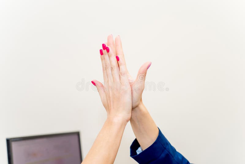 Two Businesswomen Giving High Five in an Office Stock Photo - Image of ...