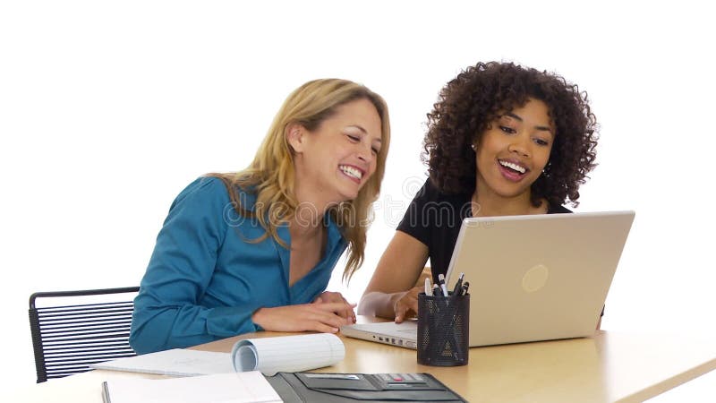 Two Businesswomen Laughing while Working on Laptop Stock Footage ...
