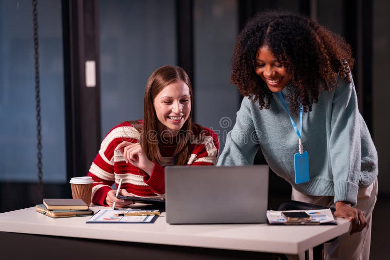 Two Businesswomen Working Overtime, Chatting in the Office, Working ...