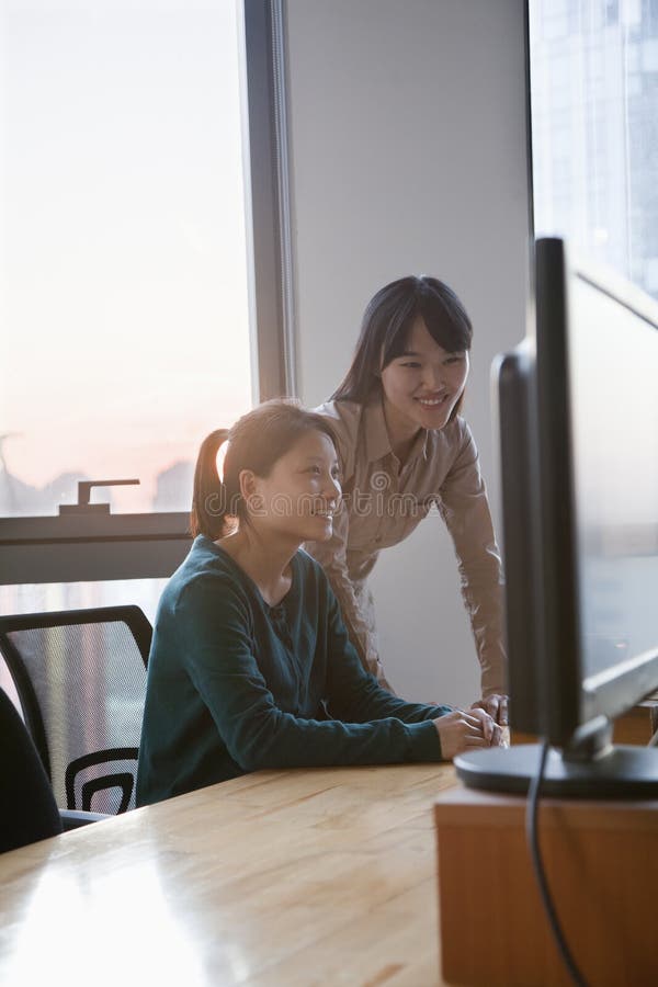 Two Businesswomen Working Together in the Office Stock Photo - Image of ...