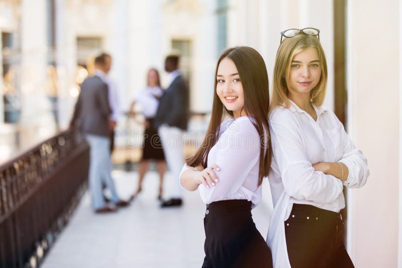 Two Bussiness Partners Women Over Team Background in Office Stock Photo ...