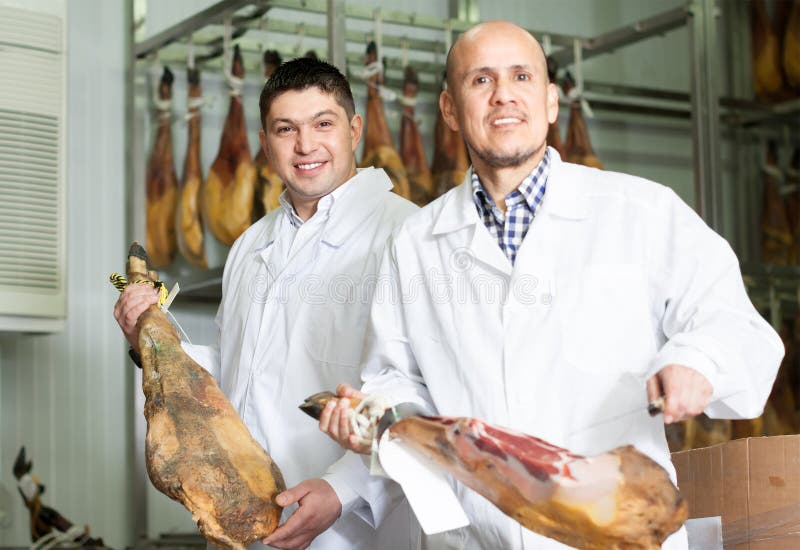 Two butcher slicing jamon stock image. Image of russian - 88267251