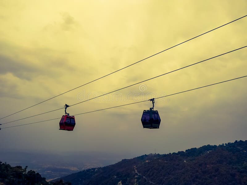 Two Cable Cars in the Mountain at Sunset Stock Photo - Image of ...