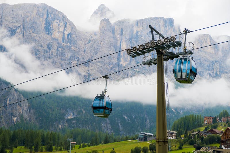 Two Cable Way Cabins Against the Dolomites Covered with Clouds Stock ...