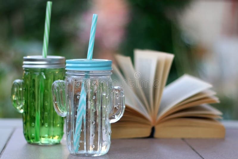 Refreshing Drink and Book stock photo. Image of adorable - 189105780