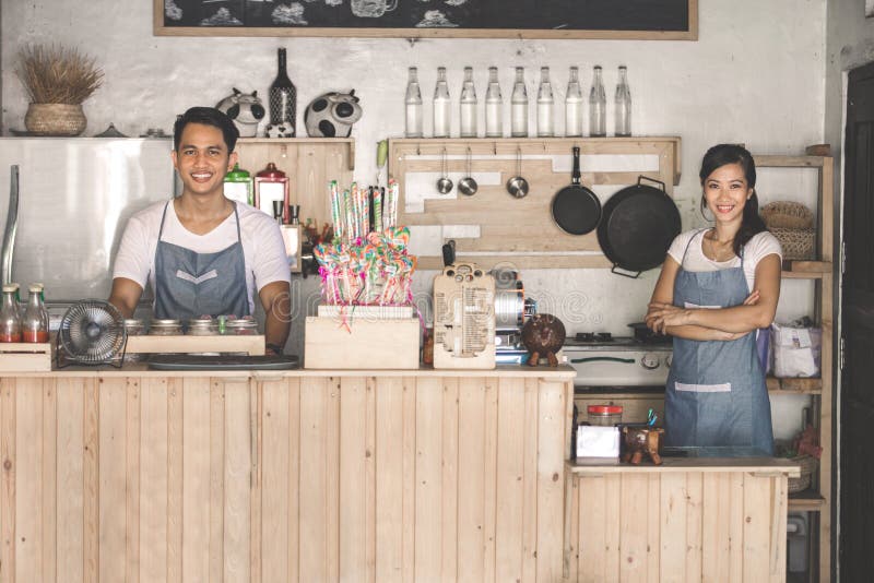 Two Cafe staff at work stock image. Image of selective - 73020755