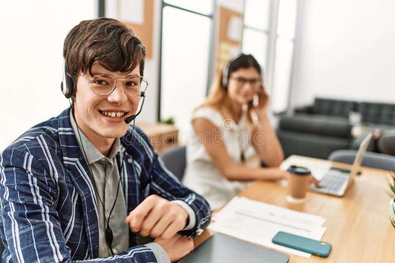 Two Call Center Agents Smiling Happy Working at the Office Stock Photo ...