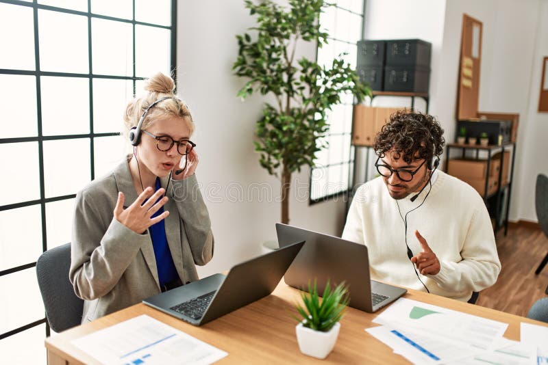 Two Call Center Agents Working at the Office Stock Image - Image of ...