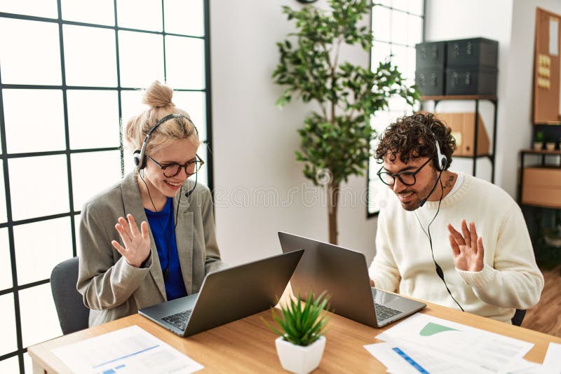 Two Call Center Agents Working at the Office Stock Photo - Image of ...
