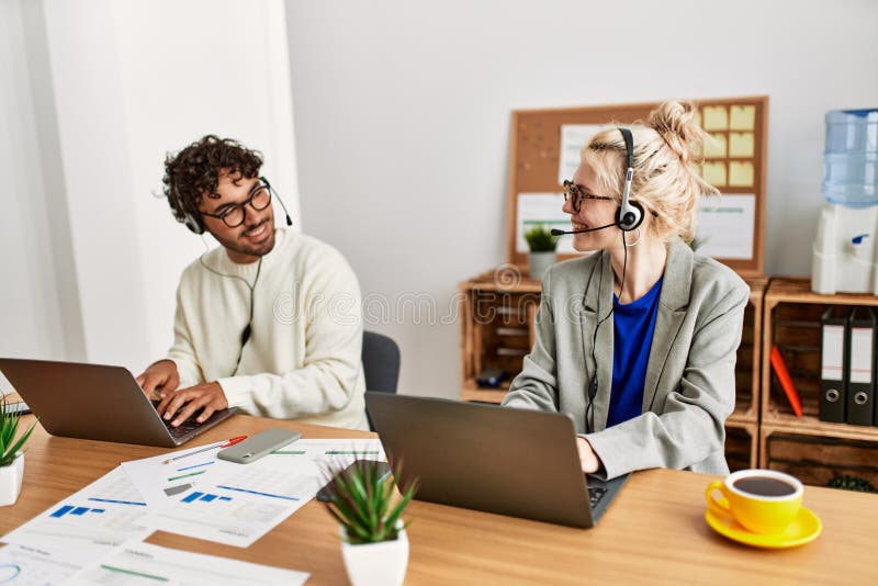 Two Call Center Agents Working at the Office Stock Photo - Image of ...