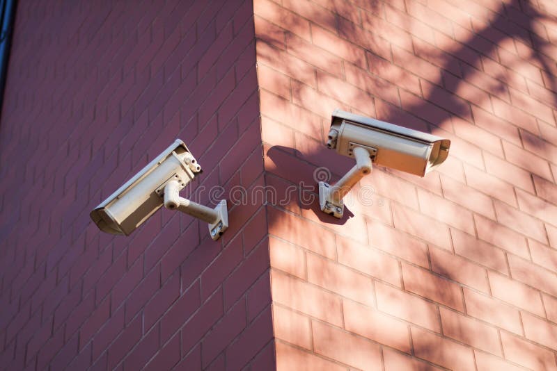 Two cameras on the wall stock photo. Image of protection - 39371506