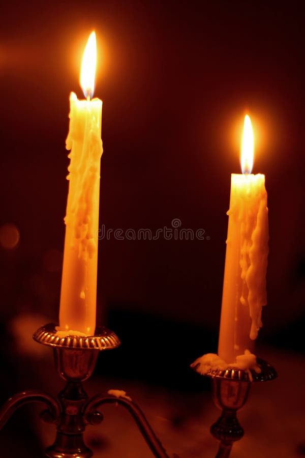 Two candles stock image. Image of restaurant, flowers - 5501249