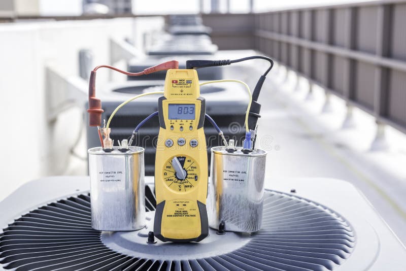 Two Capacitors Wired in Parallel Being Tested Stock Image - Image of ...