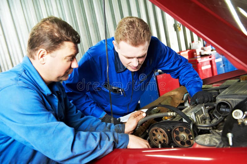 Two Car Mechanic Diagnosing Auto Engine Problem Stock Image - Image of ...