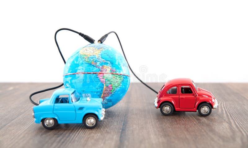 Two Car Models on the Table are Connected with a Globe, Which Means To ...