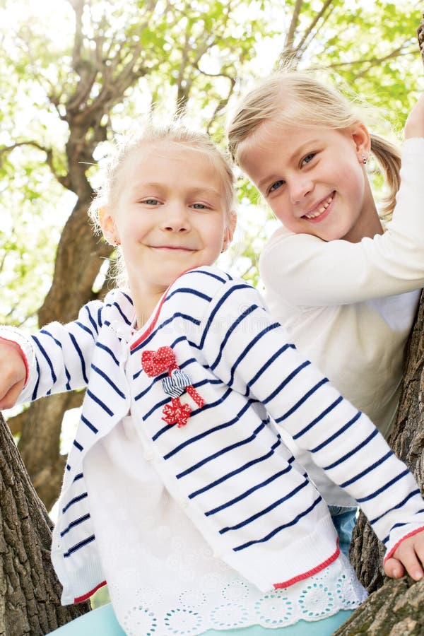 Two Carefree Little Girls in the Spring Park Stock Photo - Image of ...