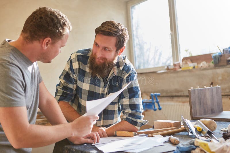 Two Carpenters Discuss an Order Stock Photo - Image of manufacturer ...