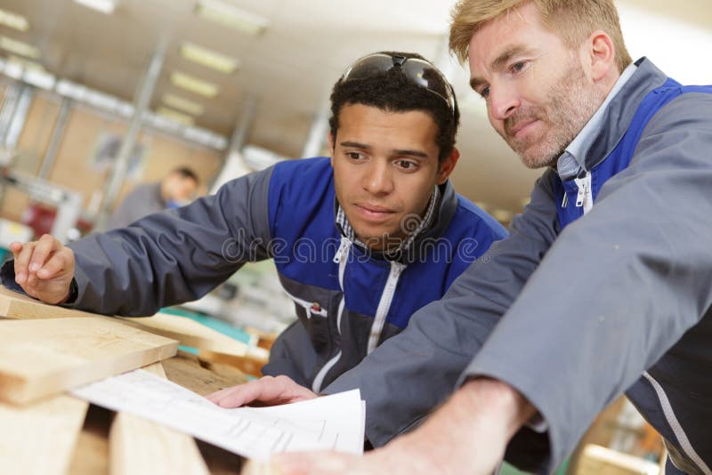 Two Carpenters Working Together in Workshop Stock Photo - Image of ...