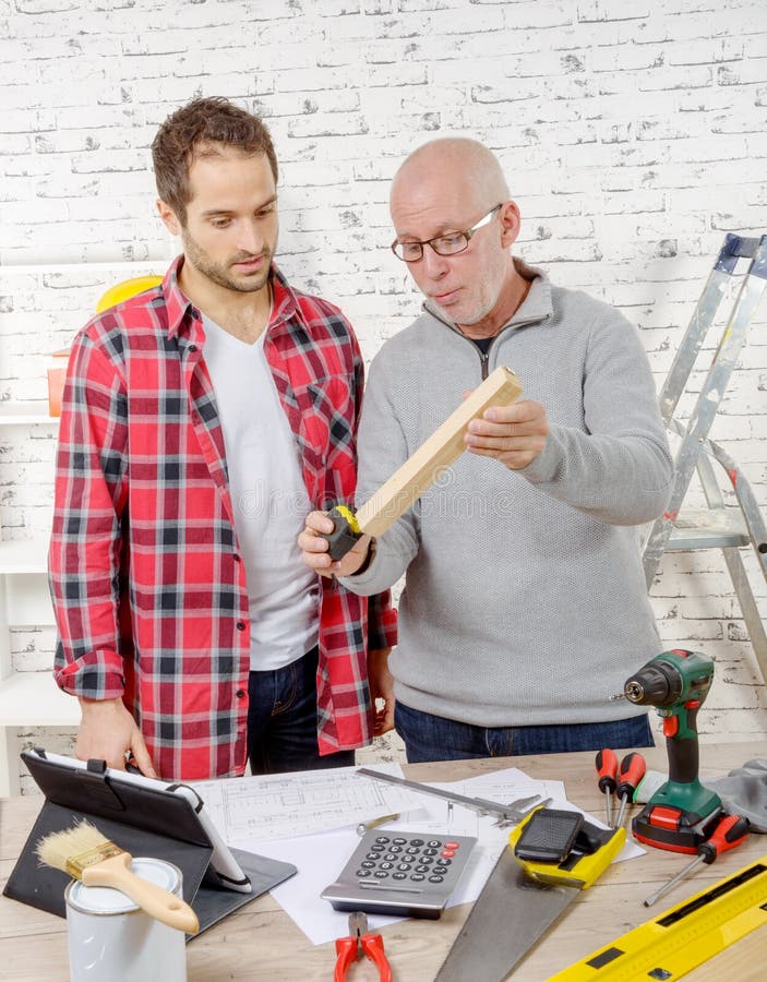 Two Carpenters Working in Their Office Stock Image - Image of team ...