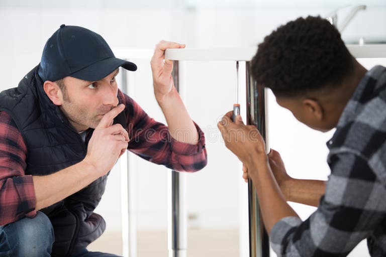 Two Carpneters Working Under Table Stock Image - Image of carrying ...