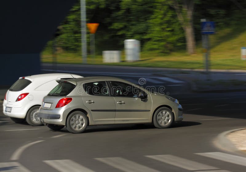 Two cars in motion stock photo. Image of outdoors, action - 73743112