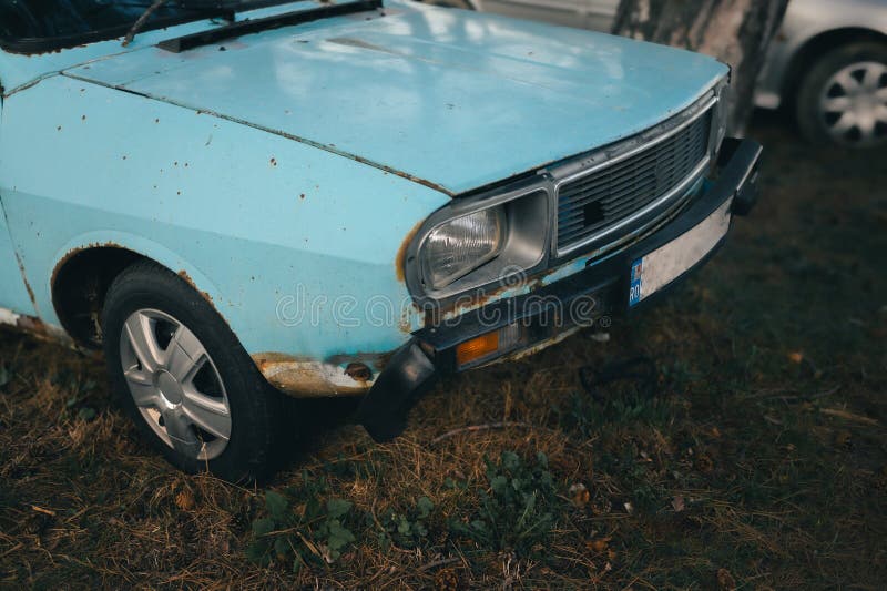 Two Cars in a Grass Field with Some Tree Limbs and Branches Stock Photo ...