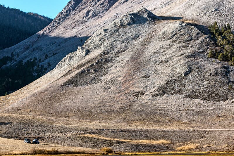 Two Cars Stand Under the Mountain Stock Image - Image of silence ...