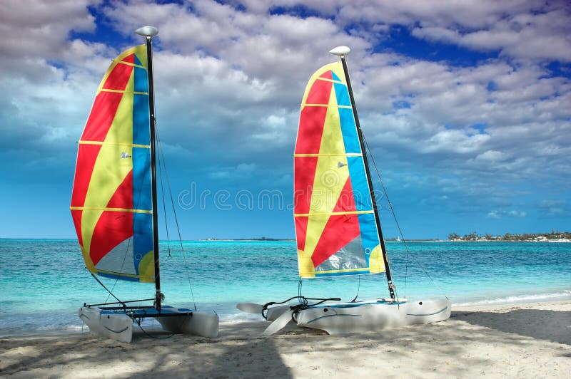 Colorful Catamaran Sailboats On A Beach Stock Image - Image of boats ...