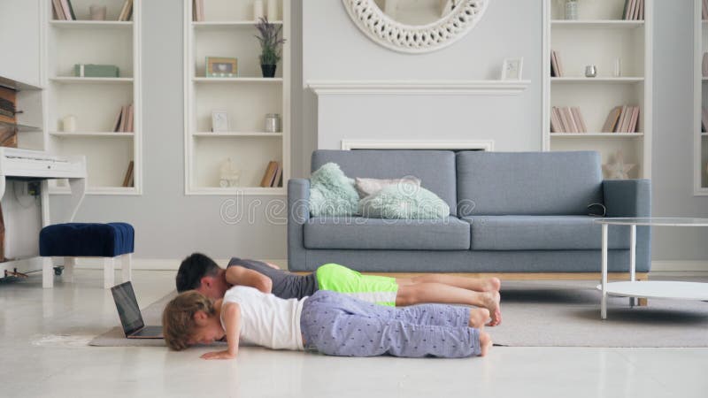 Two Caucasian Boys Doing Physical Exercise Push Ups and Abs Crunches ...