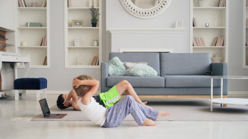 Two Caucasian Boys Doing Physical Exercise Push Ups and Abs Crunches ...