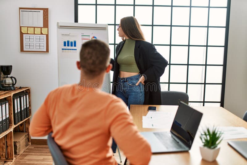 Two Caucasian Business Executives on Chart Presentation at the Office ...