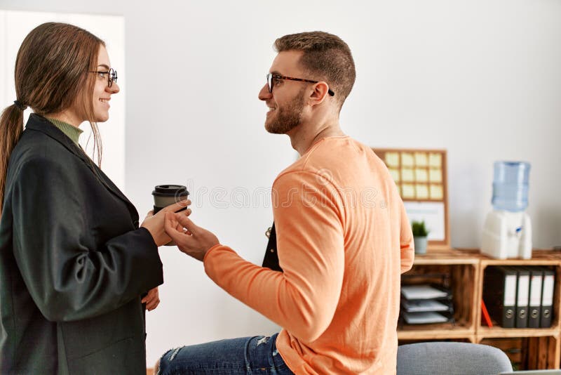 Two Caucasian Business Executives Talking and Drinking Coffee at the ...