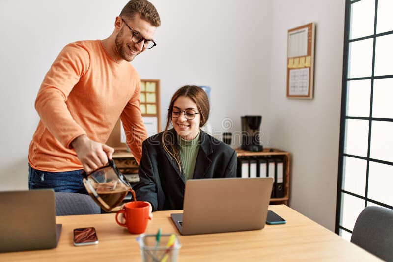 Two Caucasian Business Executives Working and Drinking Coffee at the ...
