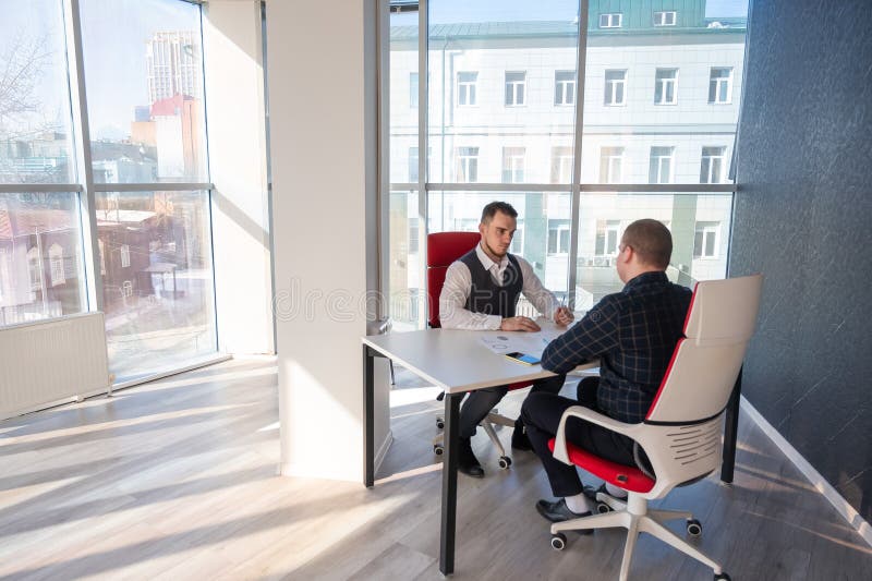Two Caucasian Men Communicating at a Business Meeting. Stock Image ...