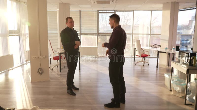 Two Caucasian Men Communicating in Sign Language in an Office. Stock ...