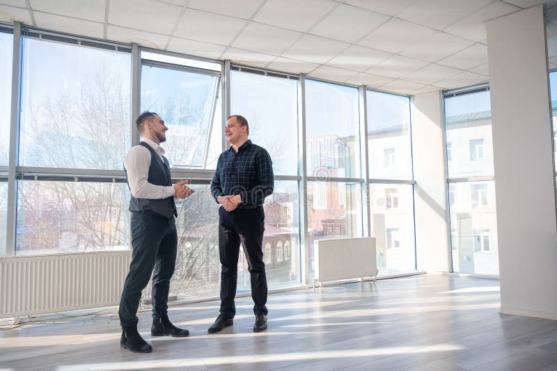 Two Caucasian Men Talking at Work in the Office. Stock Image - Image of ...
