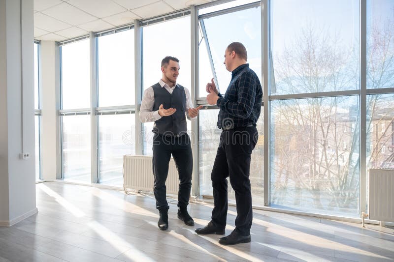 Two Caucasian Men Talking at Work in the Office. Stock Photo - Image of ...