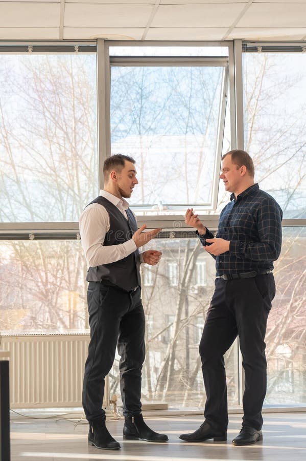 Two Caucasian Men Talking at Work in the Office. Stock Image - Image of ...