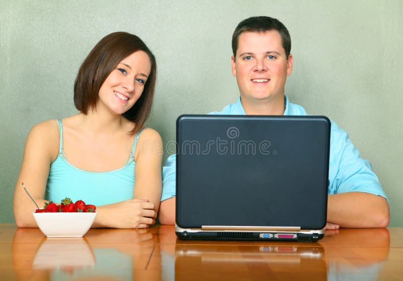 Two Caucasian Young Adults Sit on Kitchen Table Stock Photo - Image of ...