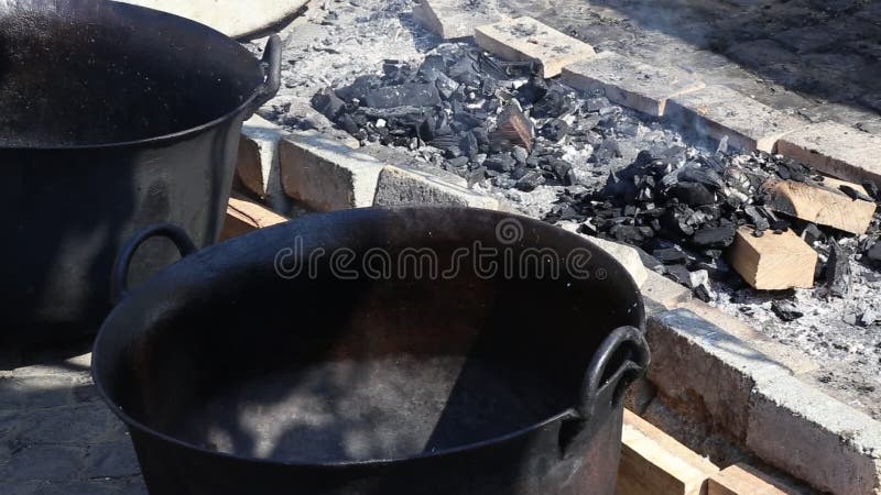 Two Cauldrons and Smoke from Fire Stock Video - Video of food, campfire ...