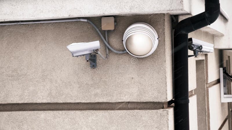 Two CCTV Security Cameras on the Wall in Falling Snow Stock Image ...