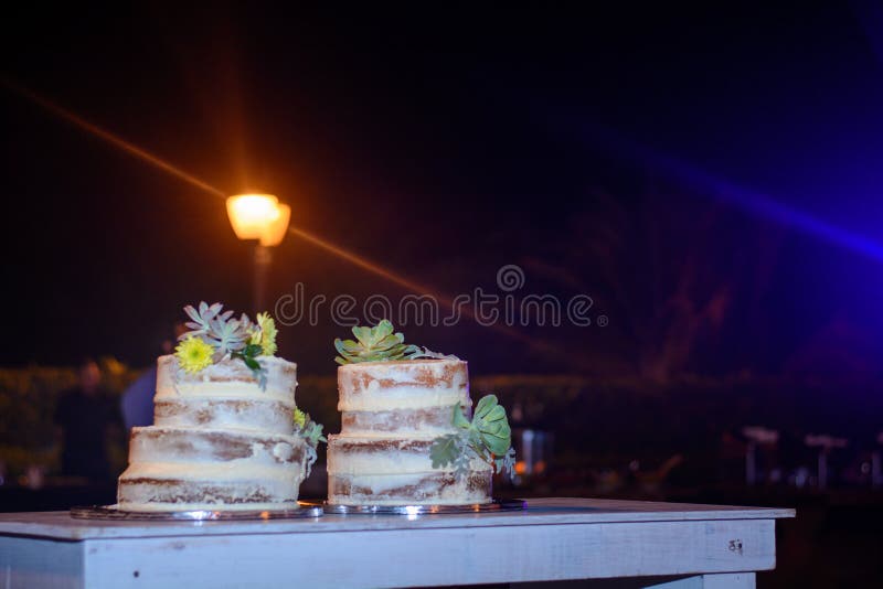 Two Celebratory Cake on a Table. Night Scene Stock Image - Image of ...