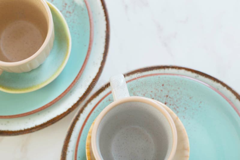 Ceramic Cups and Plates on White Marble Table Stock Image - Image of ...