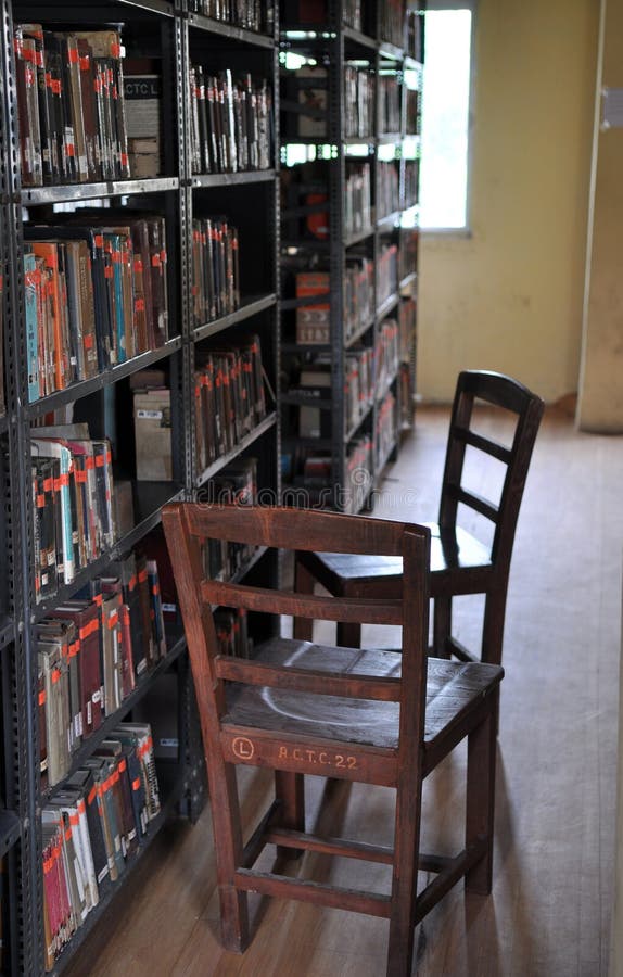 Two Chairs in Front of Big Book Shelves in a Library Stock Image ...