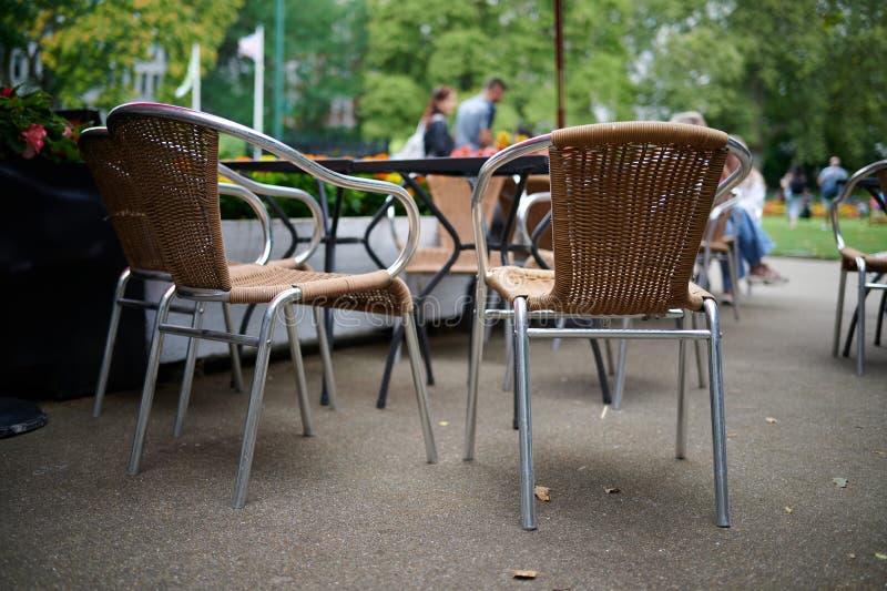 Two Chairs Next To a Table in Outdoors Cafe Stock Image - Image of ...
