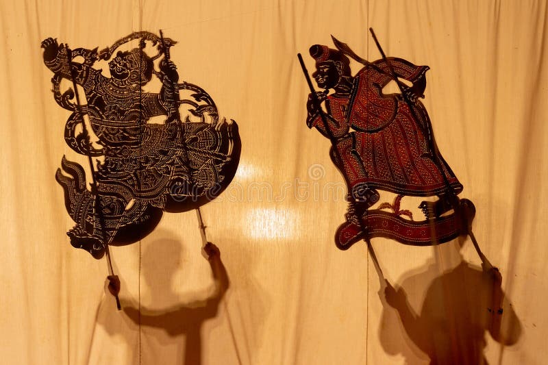 Two Charactors of the Shadow of Grand Shadow Play with the Player Hold ...