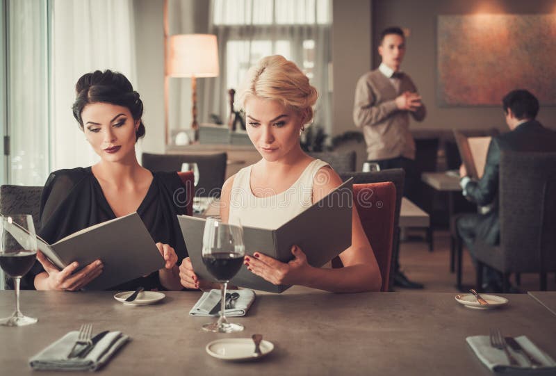 Two Charming Ladies with Menu in Restaurant Stock Photo - Image of ...