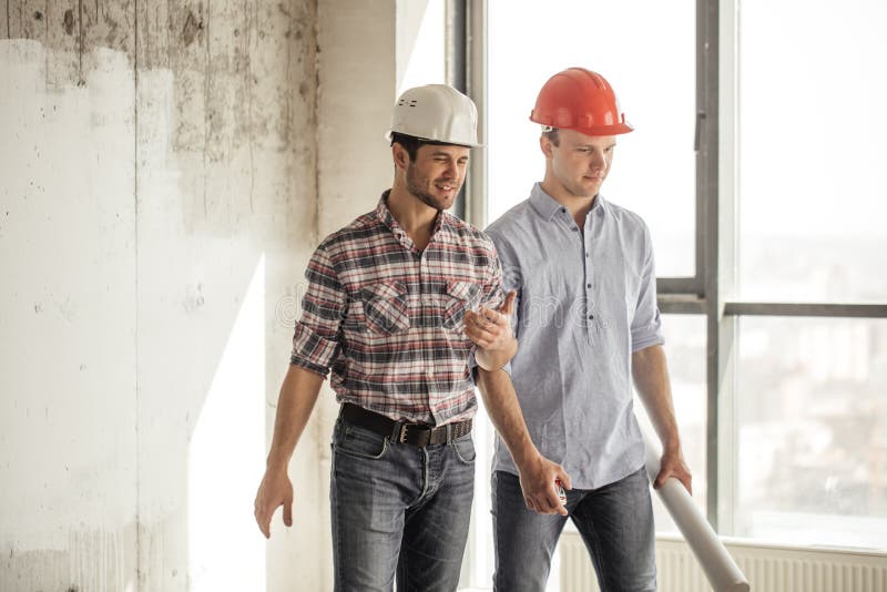 Two Cheerful Architects Walking in the Building Area Stock Image ...
