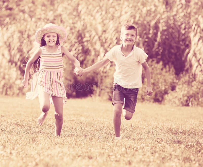 Two Cheerful Children Active Playing and Running Outdoors Stock Image ...