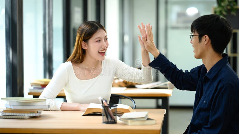 Two Cheerful College Students Celebrating Success Together. Friendship ...